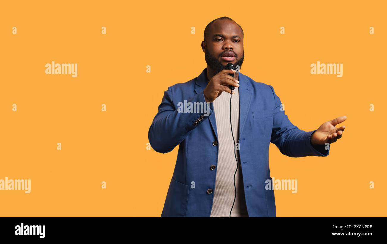 Portrait of african american lecturer holding monologue using ...