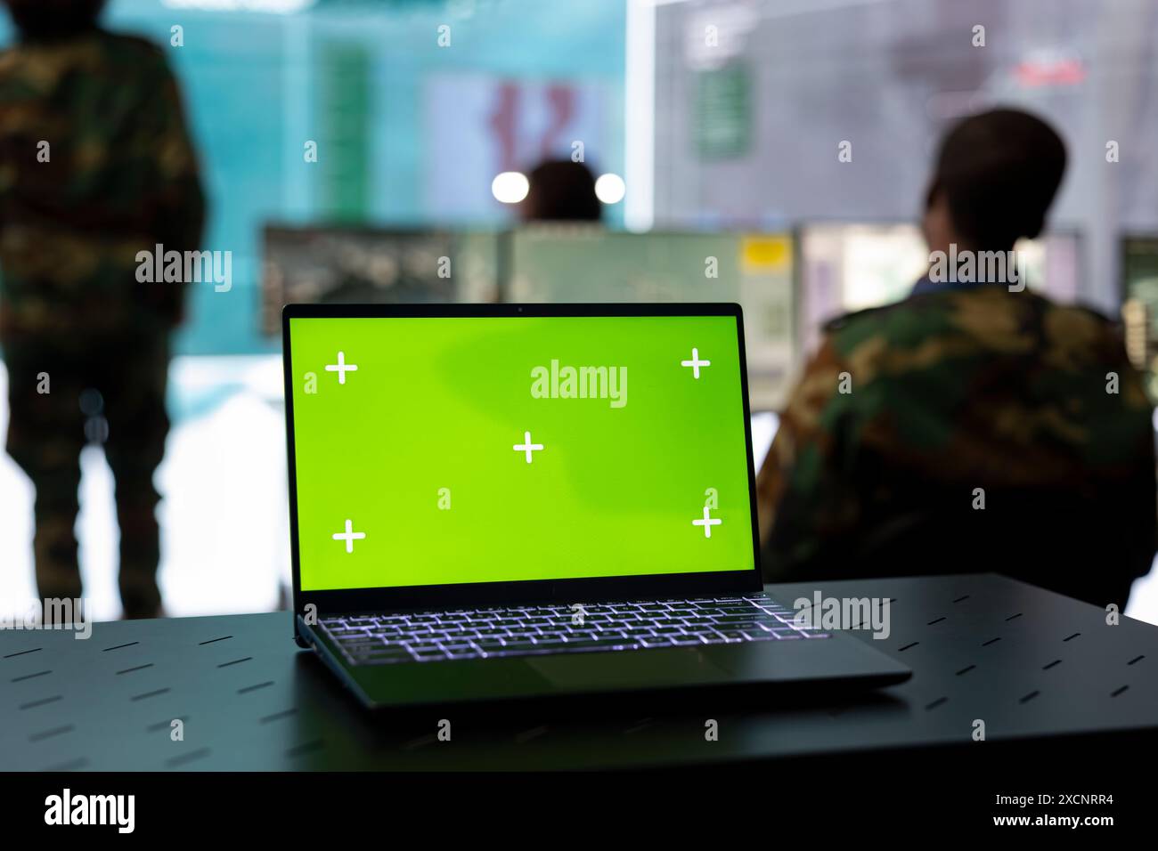 Laptop showing isolated green screen in military power base, federal ...