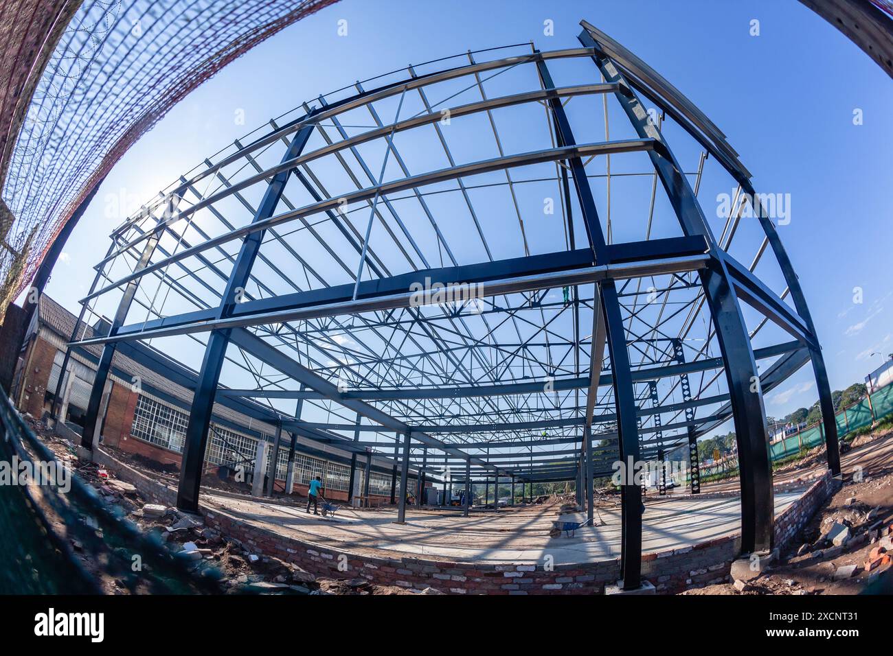 Construction new steel framed building structure halfway outdoors ...