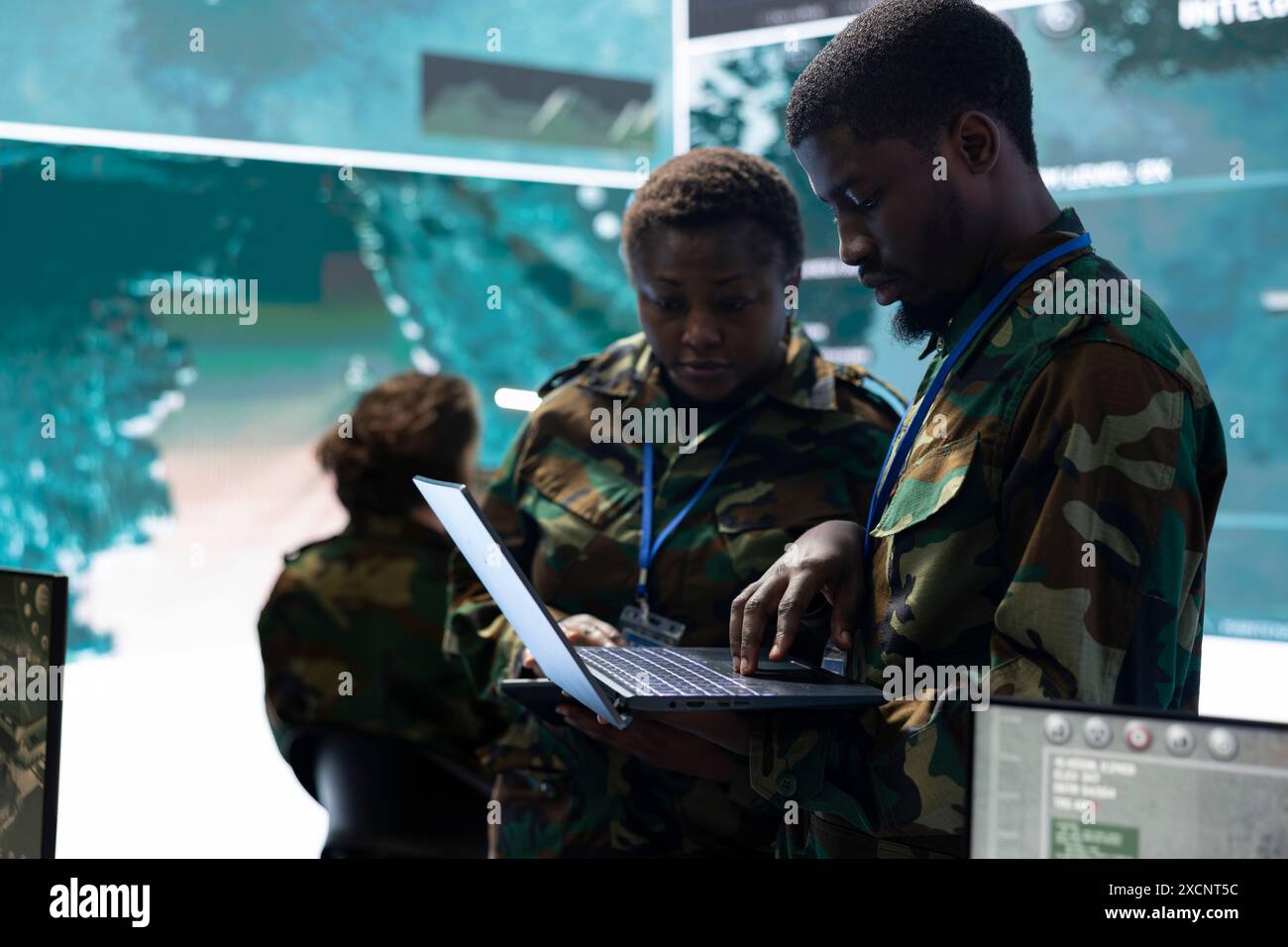 Team of army conscripts collecting important information from military radar surveillance system ...