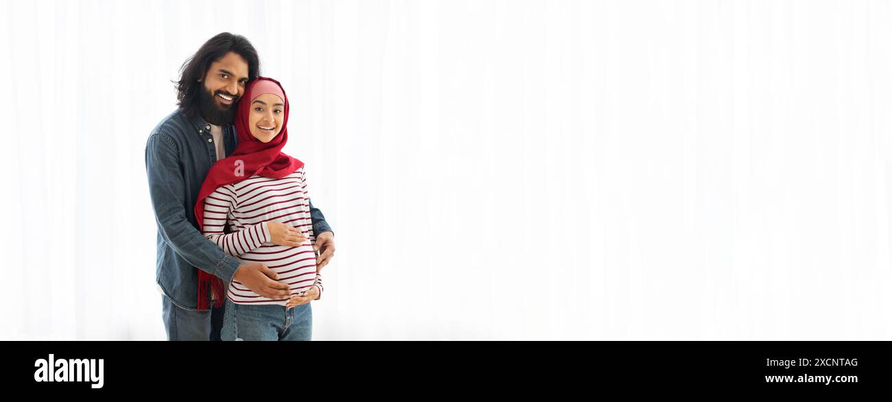 Happy Muslim Couple Expecting a Child Together Inside Home Stock Photo ...