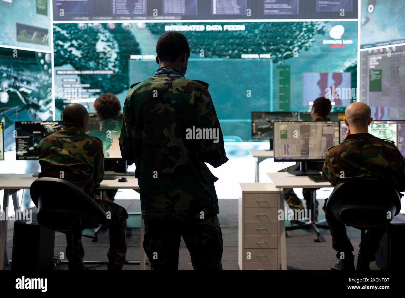 Infantry unit trooper analyzing intelligence gathered from satellite system, military command ...