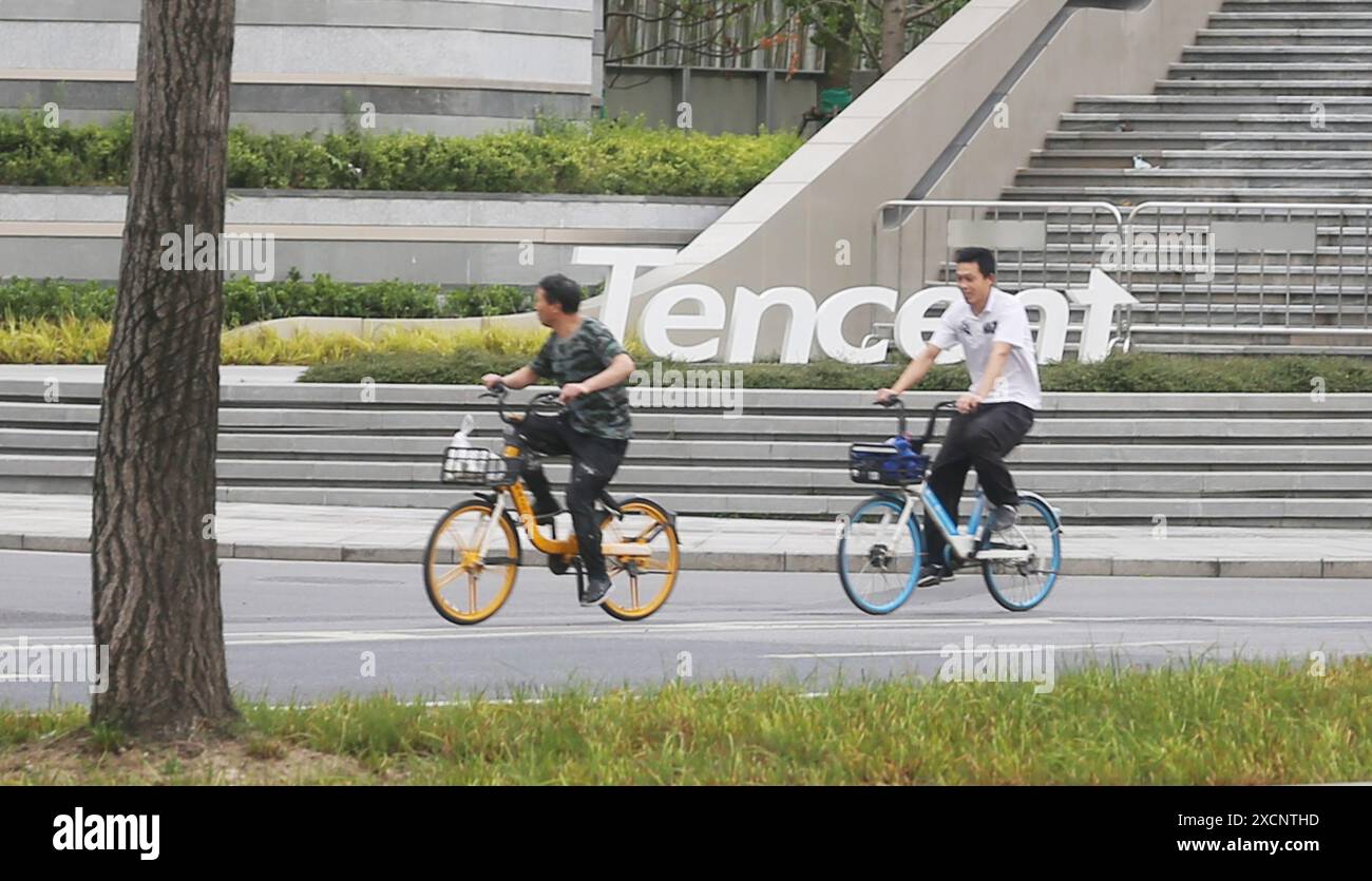 SHANGHAI, CHINA - JUNE 10, 2024 - Citizens walk past the Tencent ...