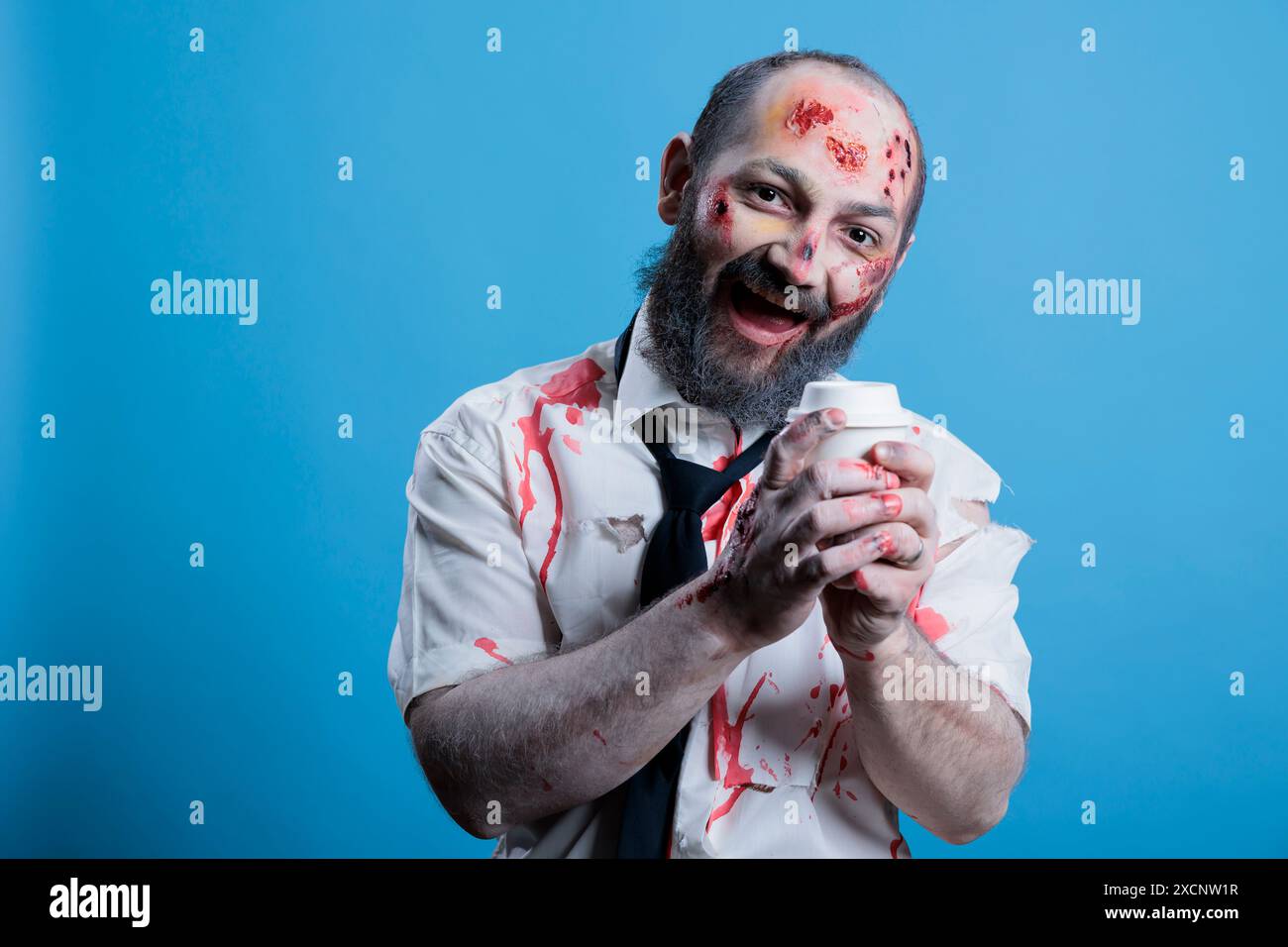 Junkie laughing like maniac after finally drinking coffee and getting ...