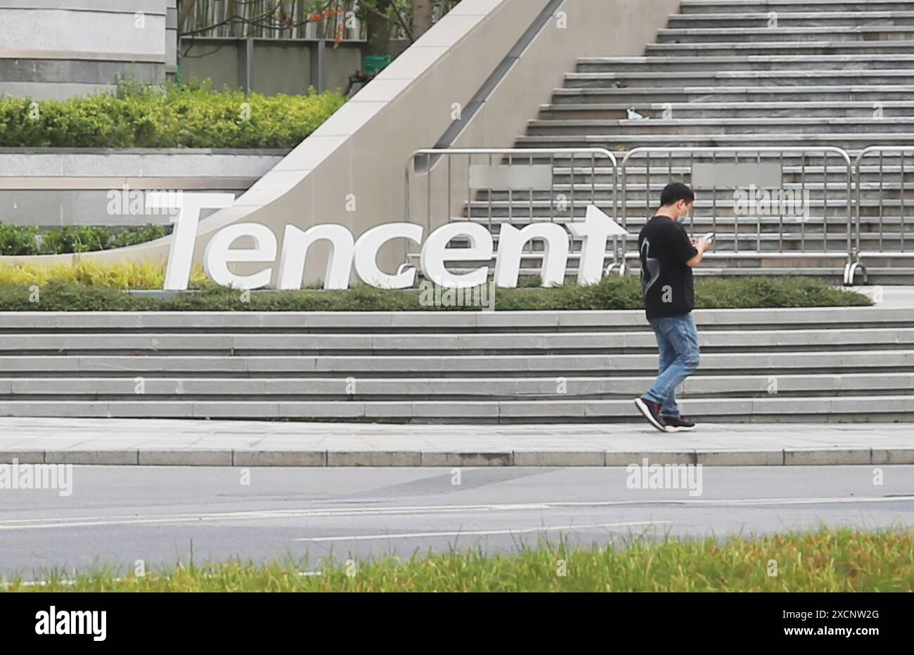 SHANGHAI, CHINA - JUNE 10, 2024 - Citizens walk past the Tencent ...