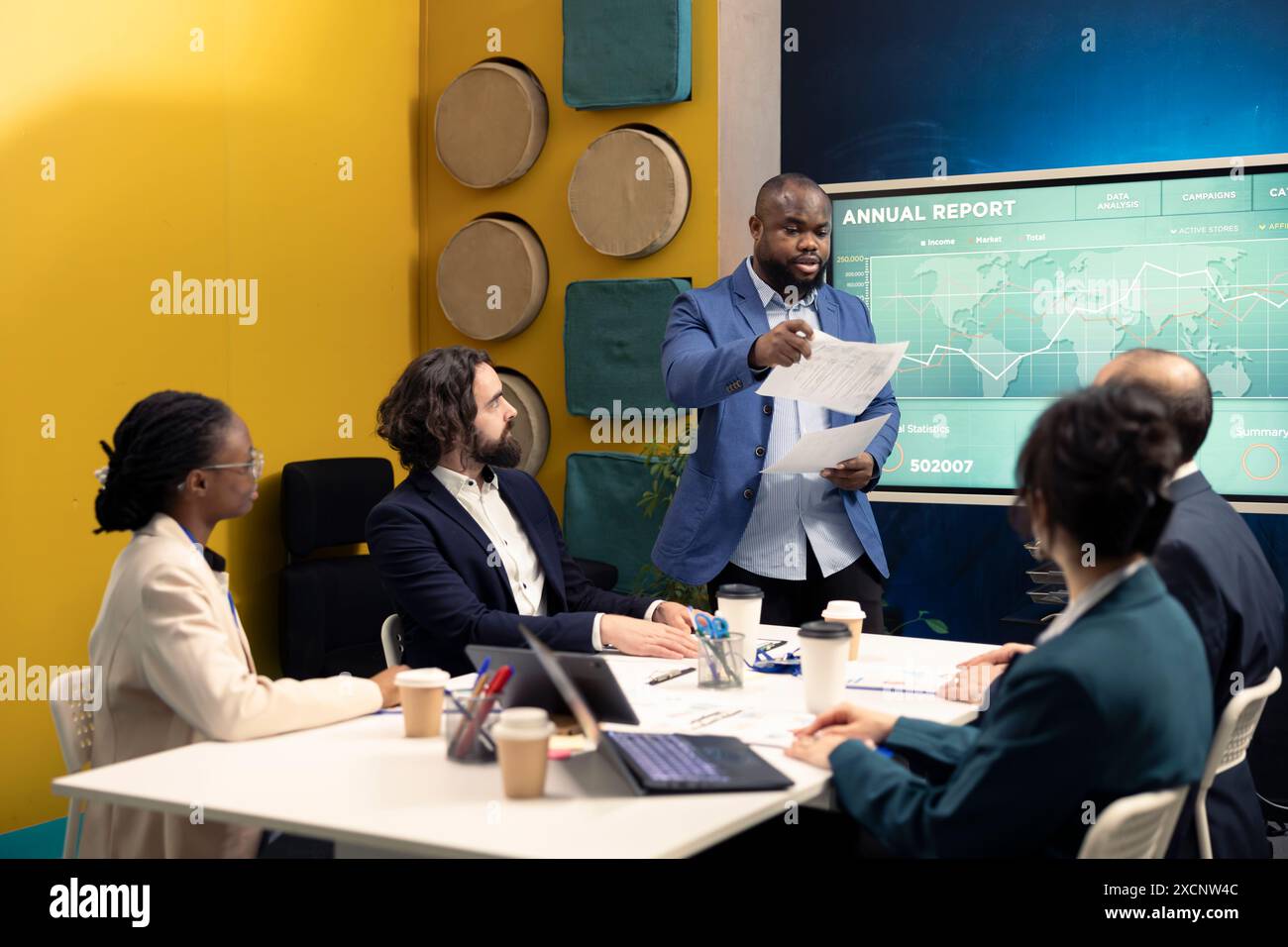 Corporate employees reviewing transactional info to improve customer ...