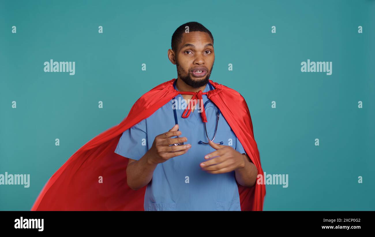 Male nurse portraying superhero showing courage and strength fighting ...