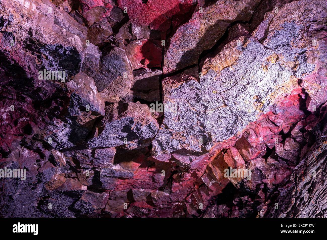 Red iron and basalt volcanic rock formations in The Lava Tunnel ...