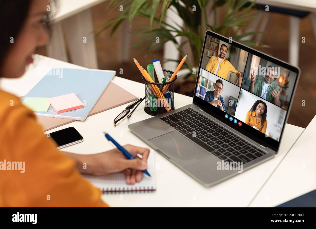 Taking notes during virtual meeting hi-res stock photography and images ...