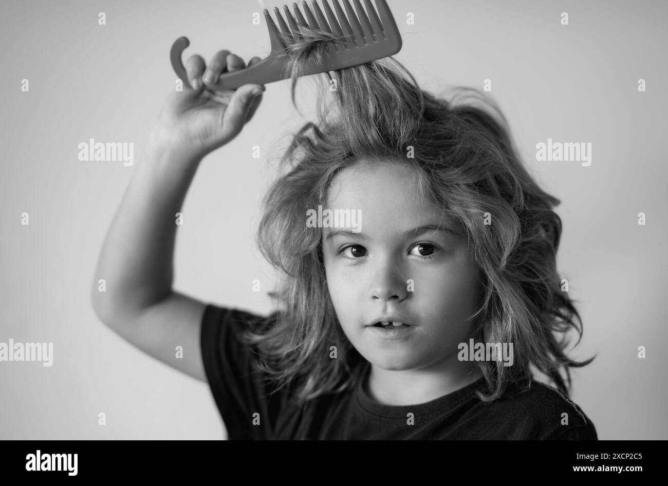 Funny child hairstyle. Child with a comb and problem hair. Kids shampoo ...