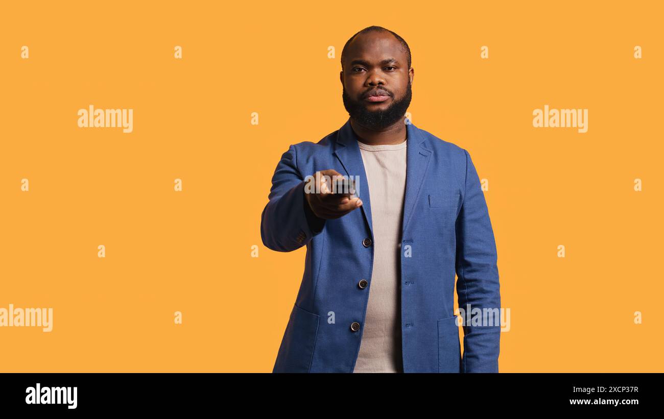 Man zapping through channels, watching news broadcast, isolated over ...