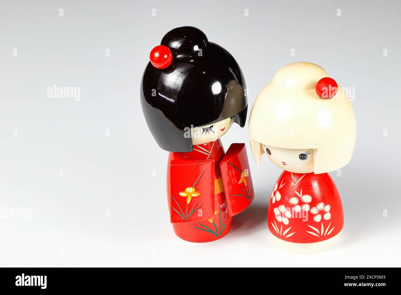 Japanese wooden dolls "kokeshi" in red Kimono suit, toy for a decoration, souvenir from Japan ...