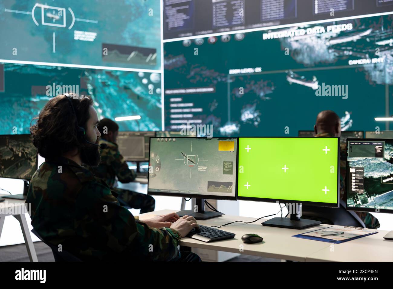 Professional IT engineer looks at surveillance footage and isolated ...