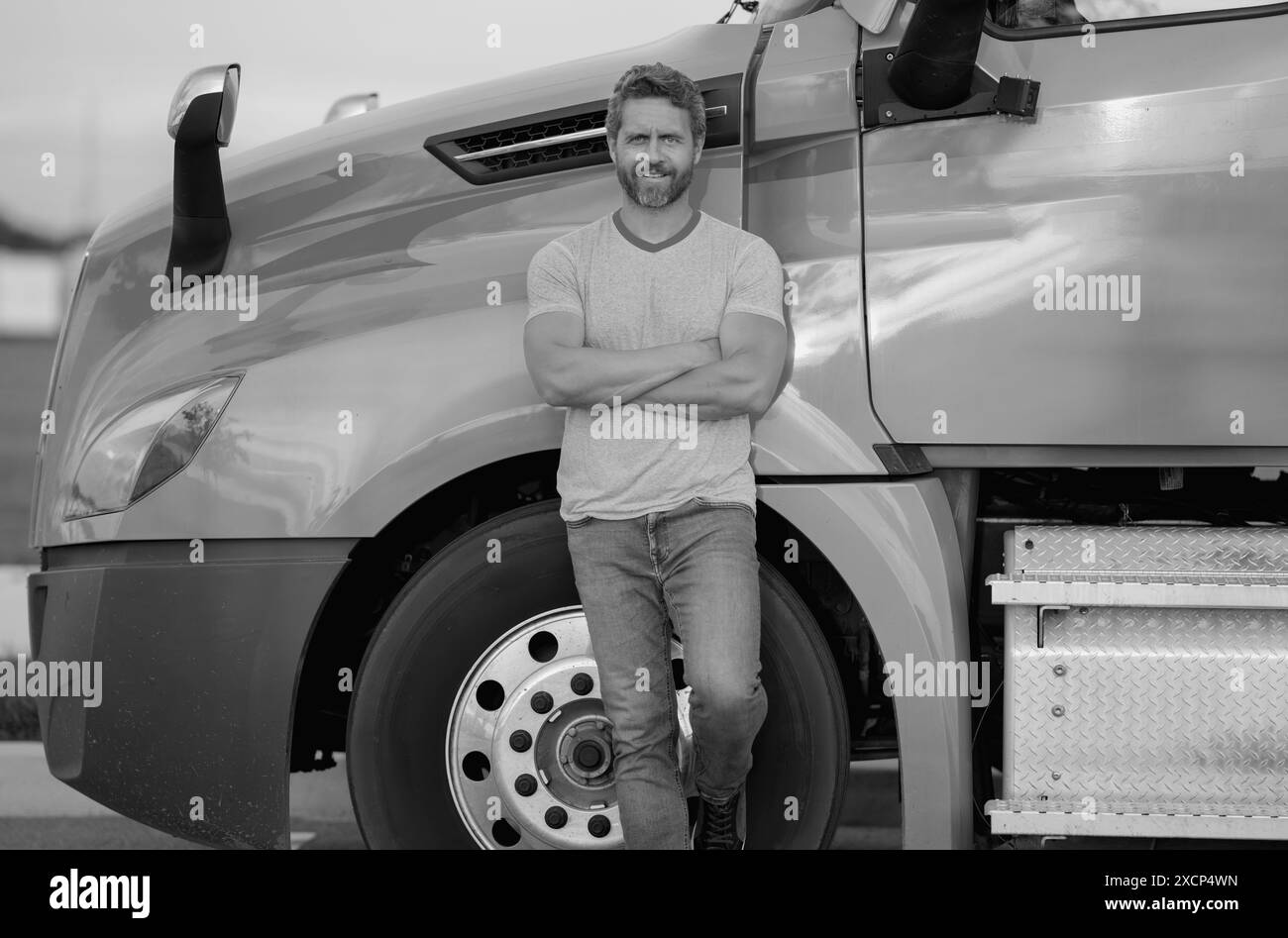 Men driver near lorry truck. Truck driver in safety vest near truck ...