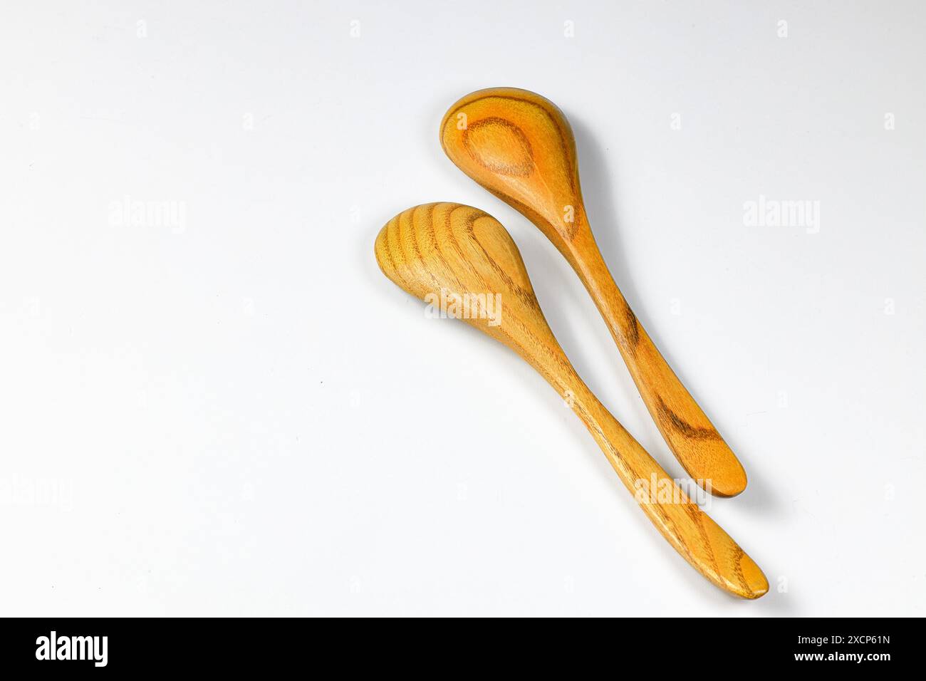 Empty wooden spoons placed upside down isolated on white Background ...