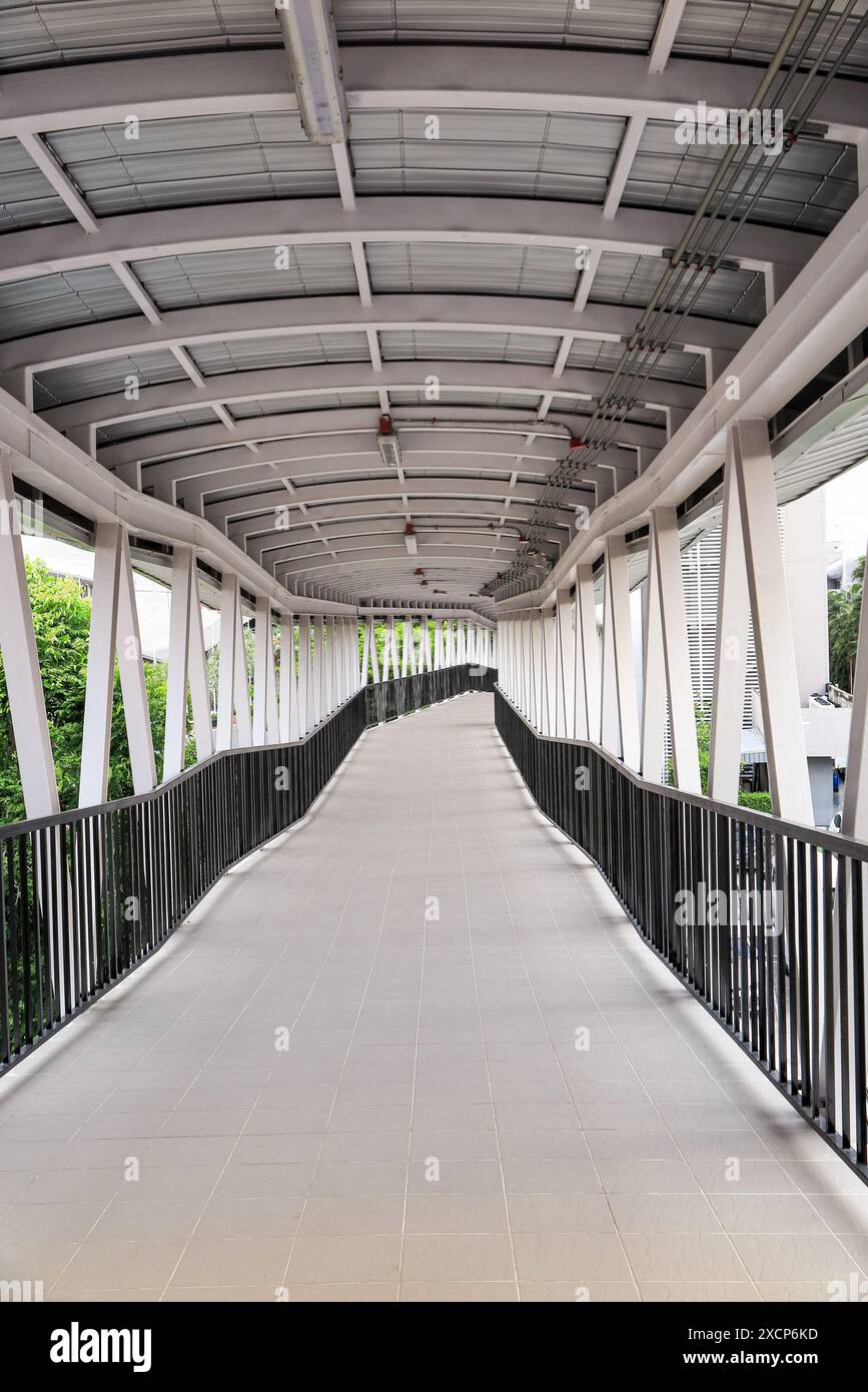 Pedestrian pathway or corridor or hallway between train station and ...