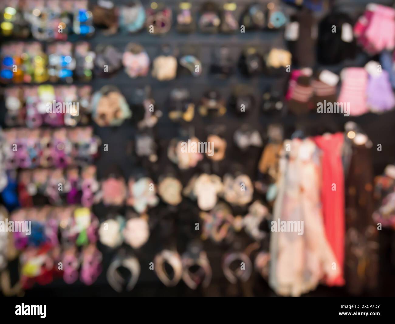 clothing accessories on shelves in clothing store blur background Stock ...