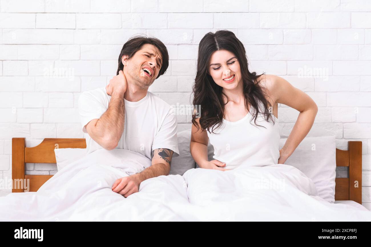 Couple Experiencing Pain After Sleeping On A Bad Mattress Stock Photo ...
