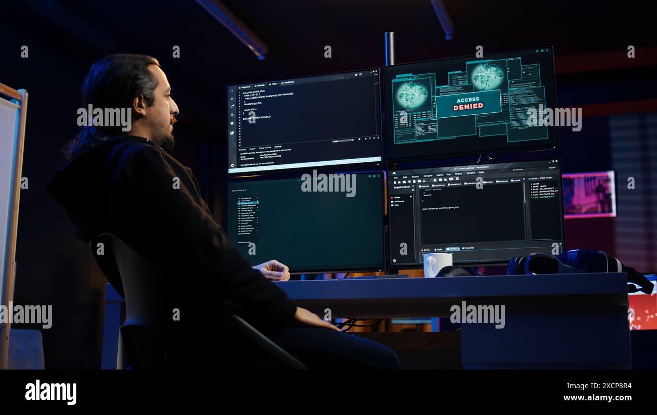 Hacker in hidden apartment trying to steal valuable data by targeting ...