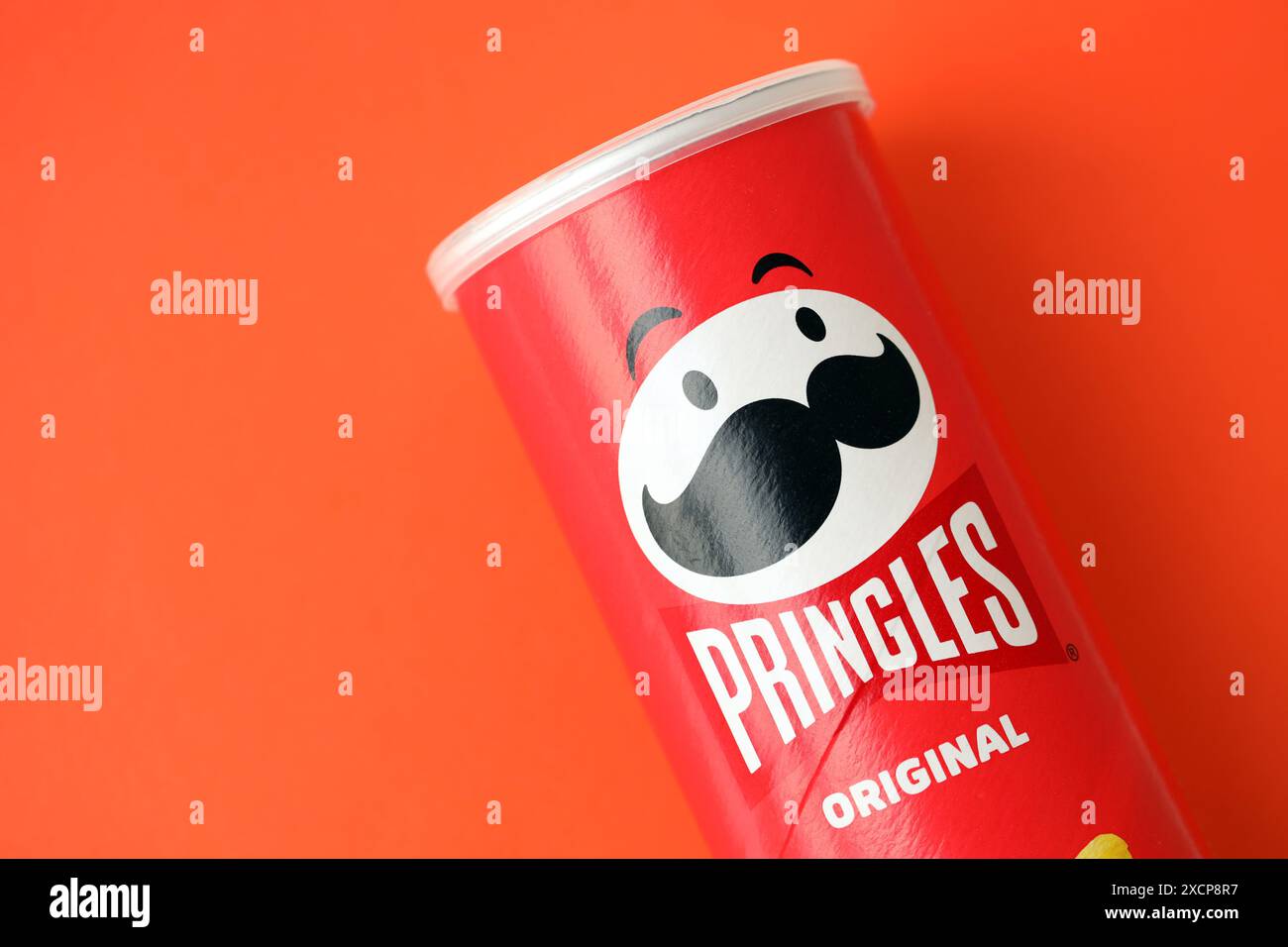 KYIV, UKRAINE - APRIL 20, 2024 Pringles original potato chips on red ...