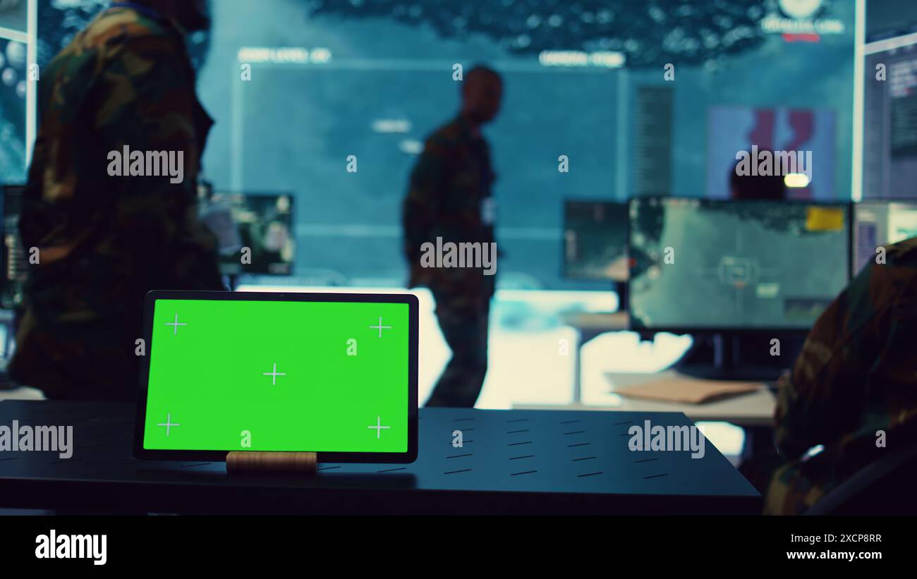Tablet with greenscreen display running in a command post base of ...