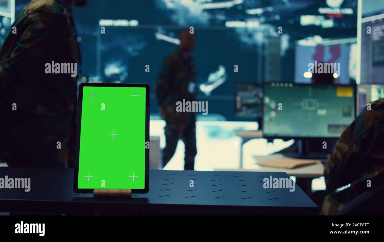 General headquarters monitoring room with a mockup screen on tablet ...