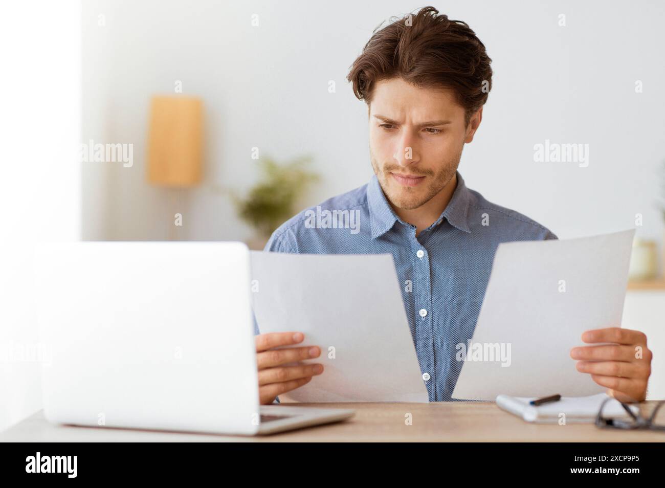Professional man reviews documents hi-res stock photography and images ...