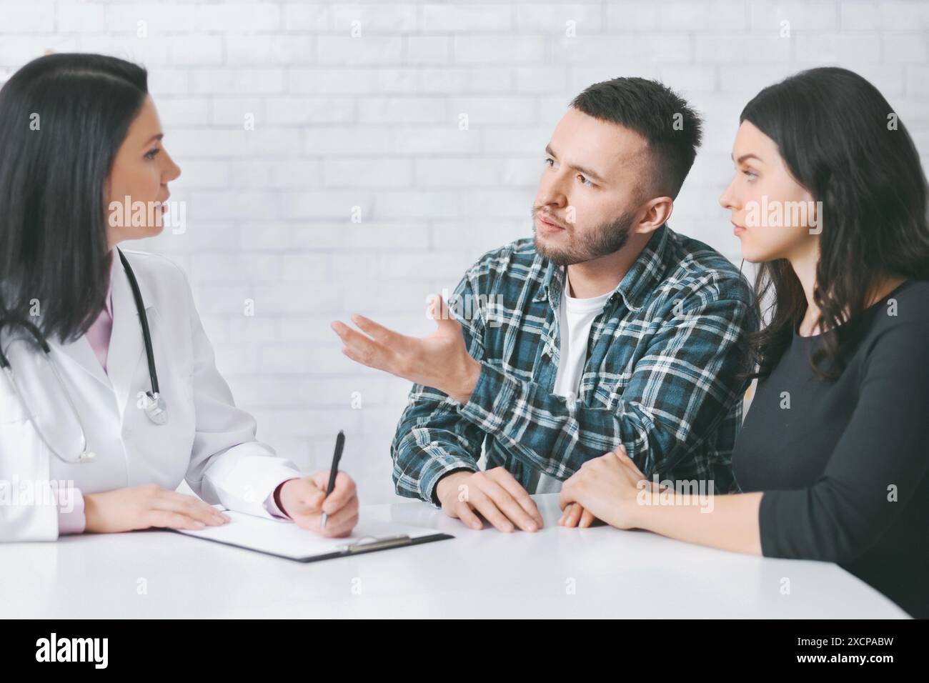 Couple discussing medical concerns hi-res stock photography and images ...