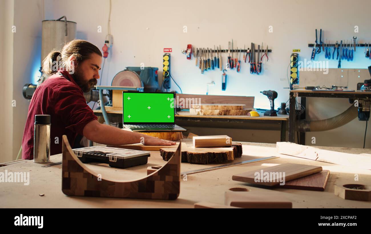 Upbeat men using CAD software on isolated screen laptop, debating wood ...