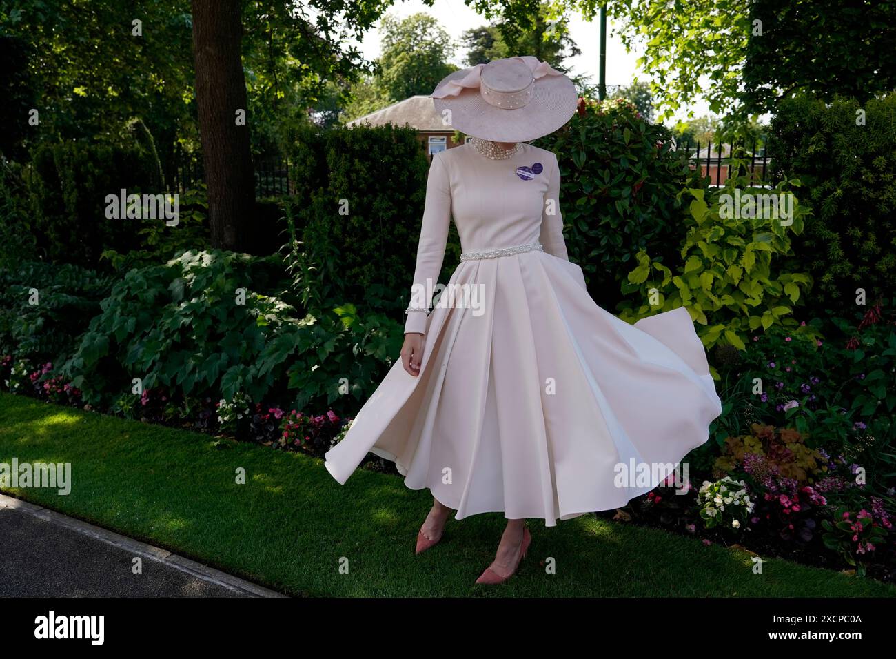 Rosie Tapner poses for the media as she arrives on the first day of the ...