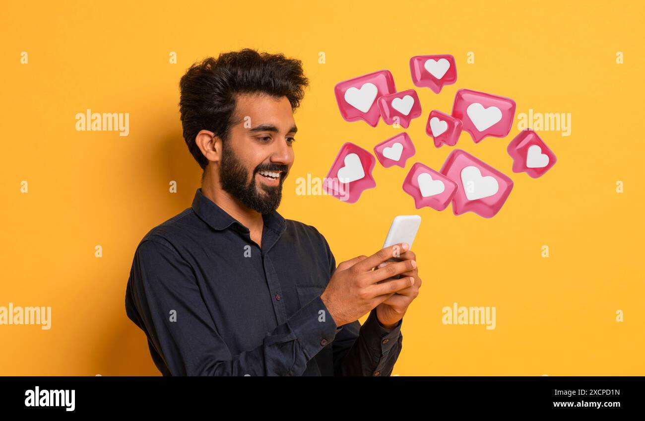 Excited Young Indian Man Looking At Smartphone Screen, Texting Lover ...