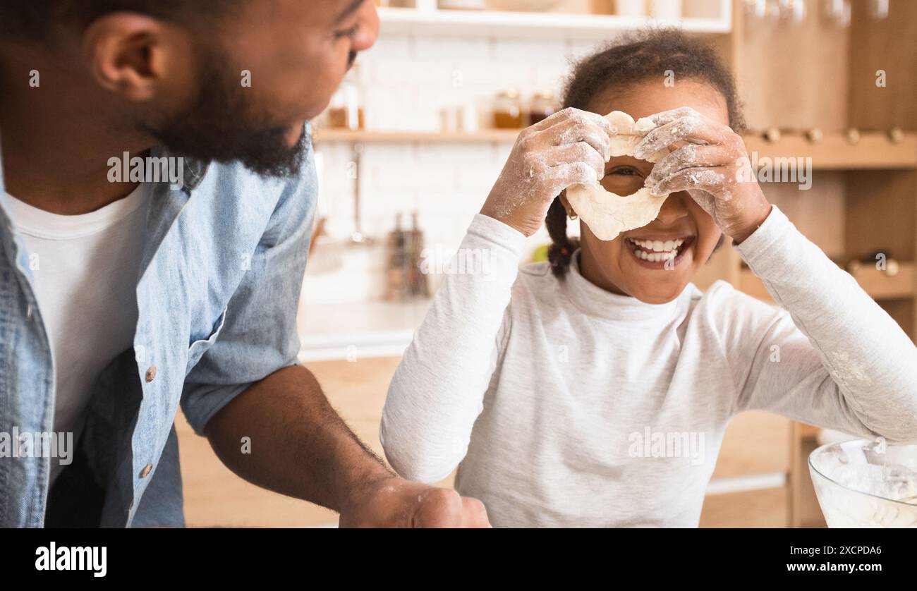 Father teaching child to cook in kitchen Stock Photo - Alamy