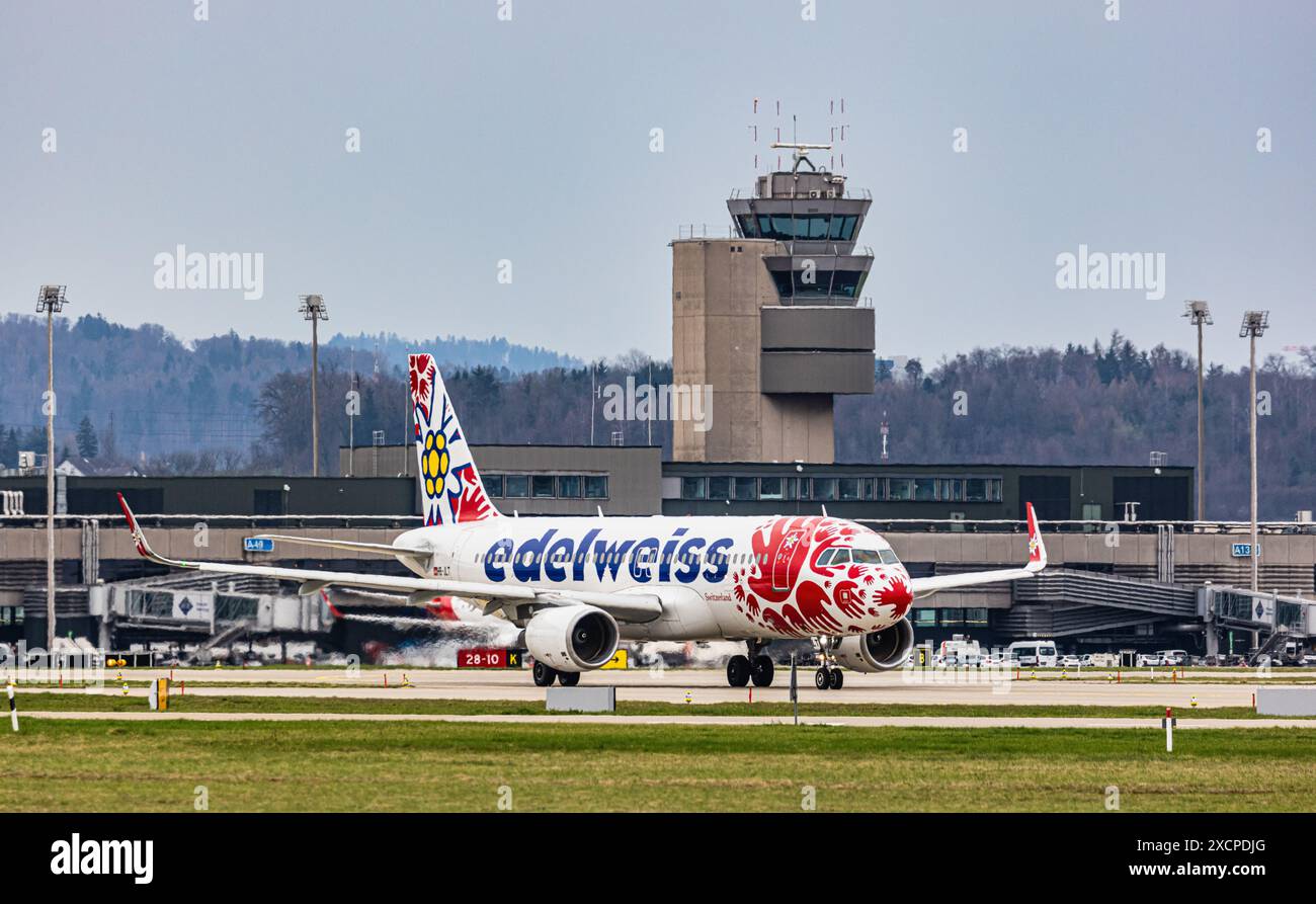 An Airbus A320-214 operated by Edelweiss Air taxies to the runway at ...