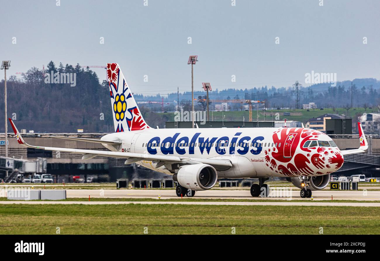 An Airbus A320-214 operated by Edelweiss Air taxies to the runway at ...