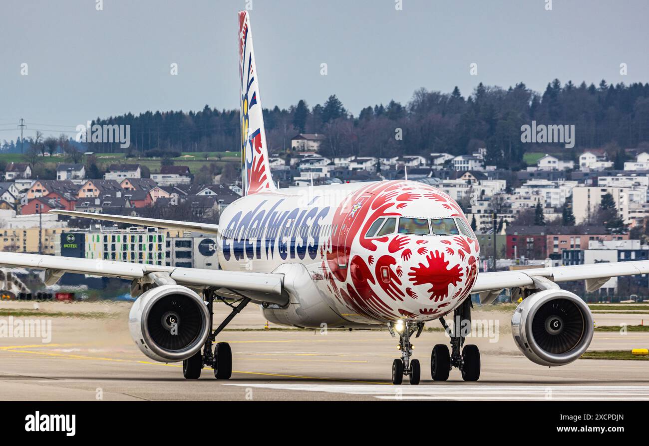 An Airbus A320-214 operated by Edelweiss Air taxies to the runway at ...