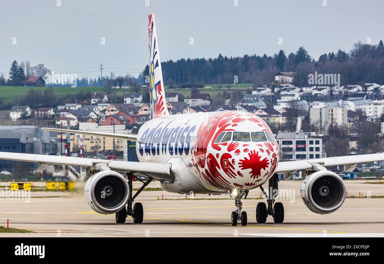 An Airbus A320-214 operated by Edelweiss Air taxies to the runway at ...