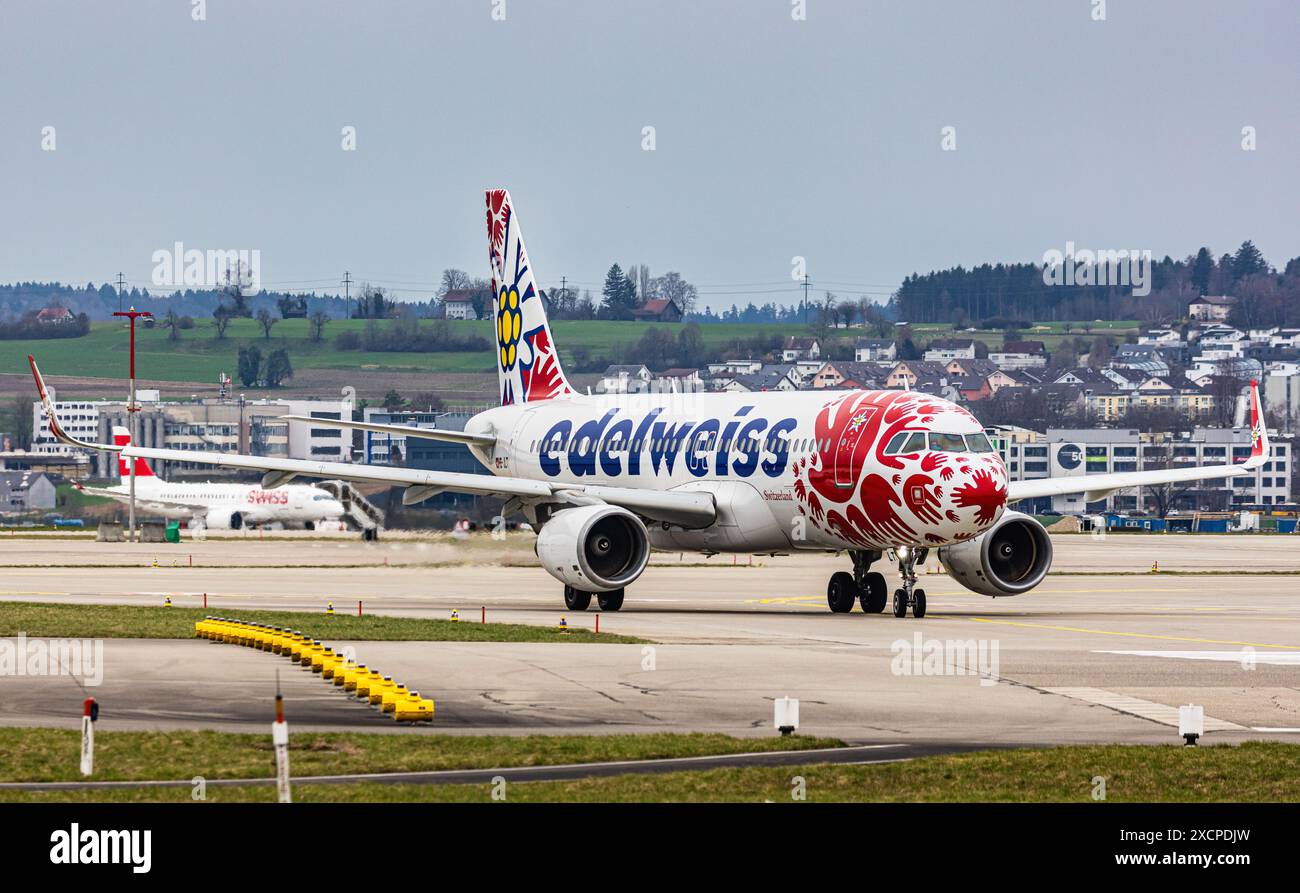 An Airbus A320-214 operated by Edelweiss Air taxies to the runway at ...