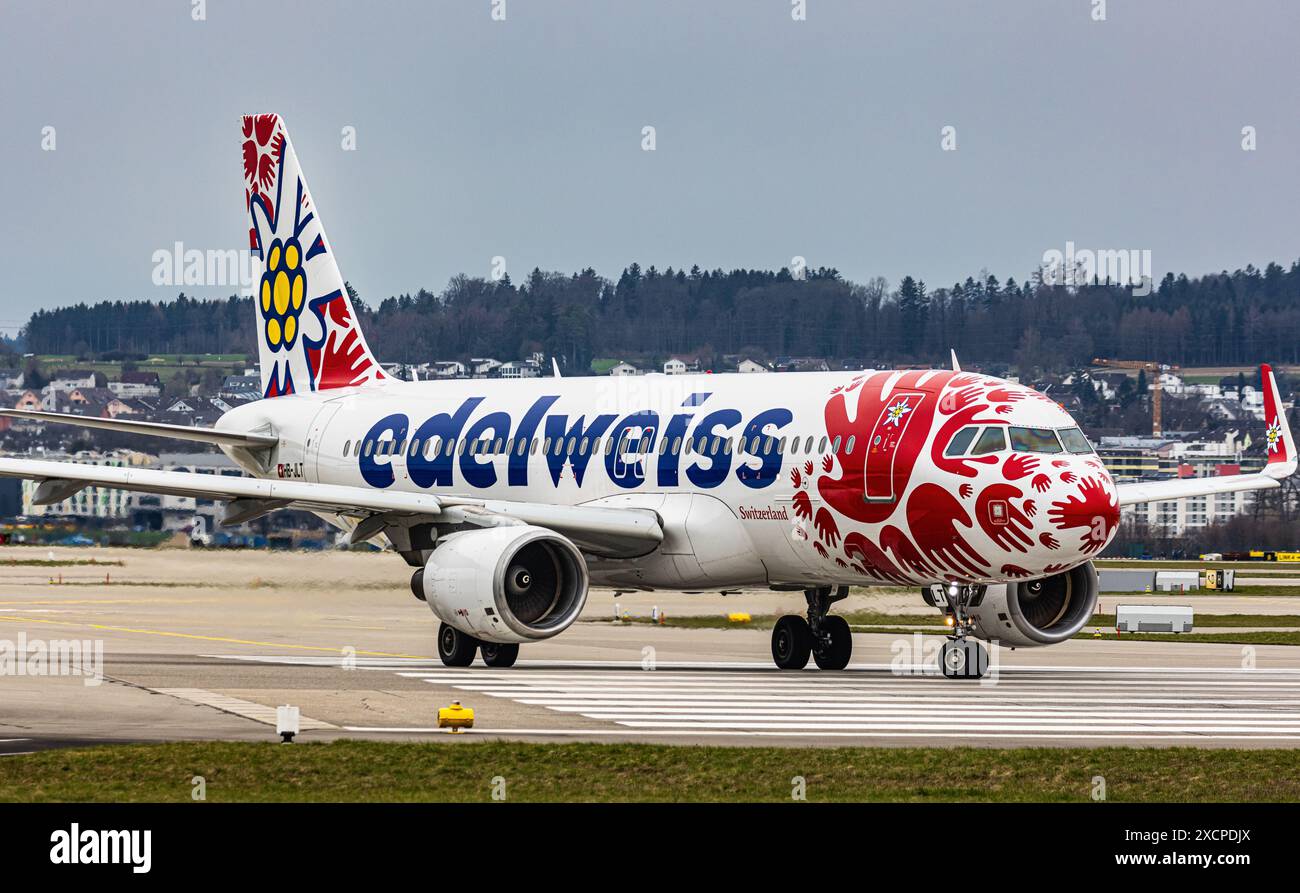 An Airbus A320-214 operated by Edelweiss Air taxies to the runway at ...