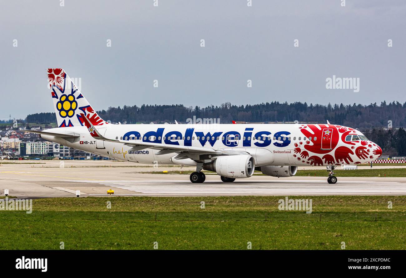 An Airbus A320-214 operated by Edelweiss Air taxies to the runway at ...