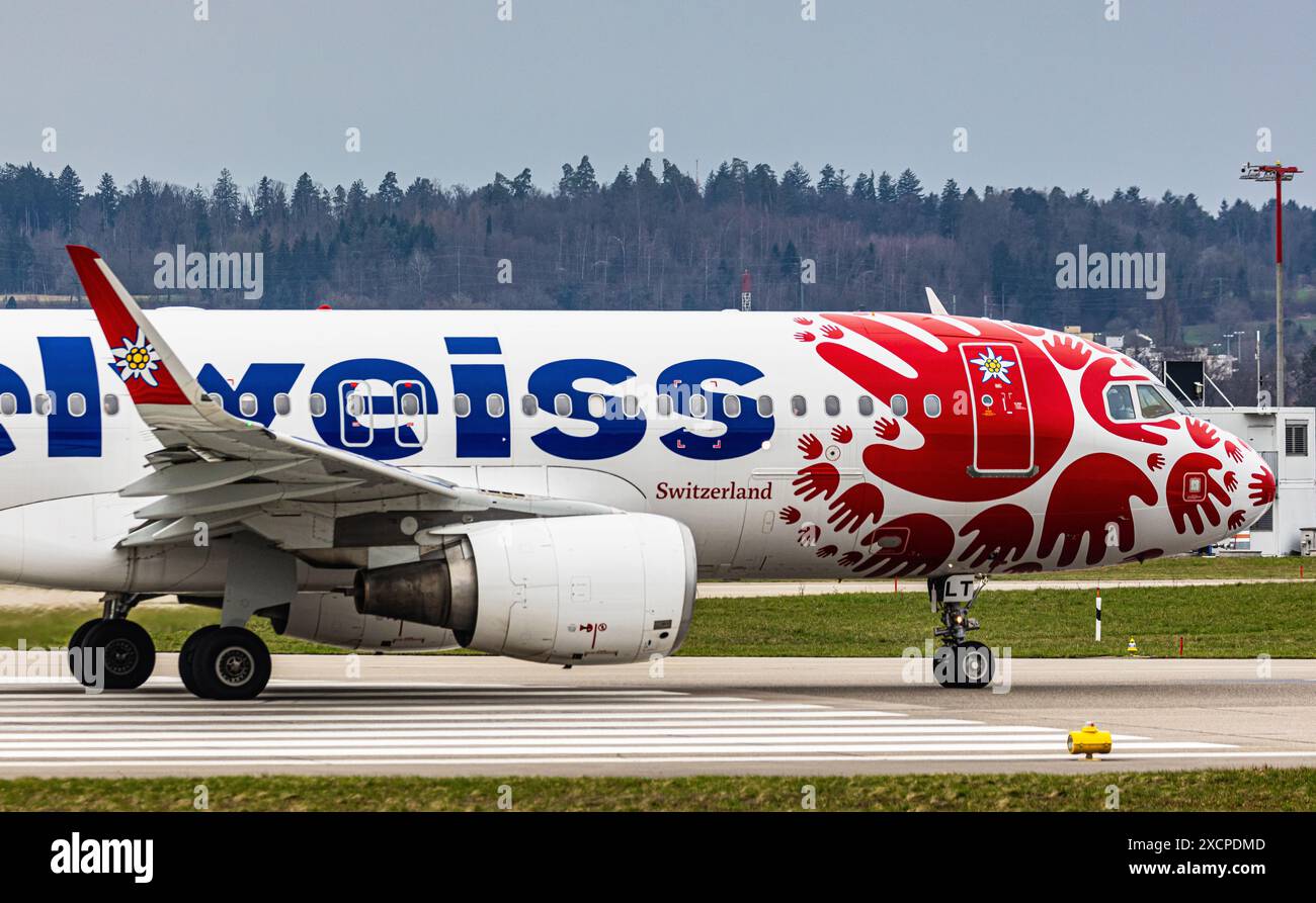 An Airbus A320-214 operated by Edelweiss Air taxies to the runway at ...