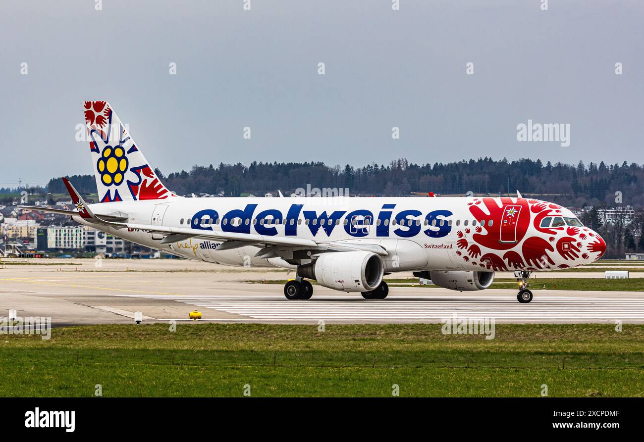 An Airbus A320-214 operated by Edelweiss Air taxies to the runway at ...