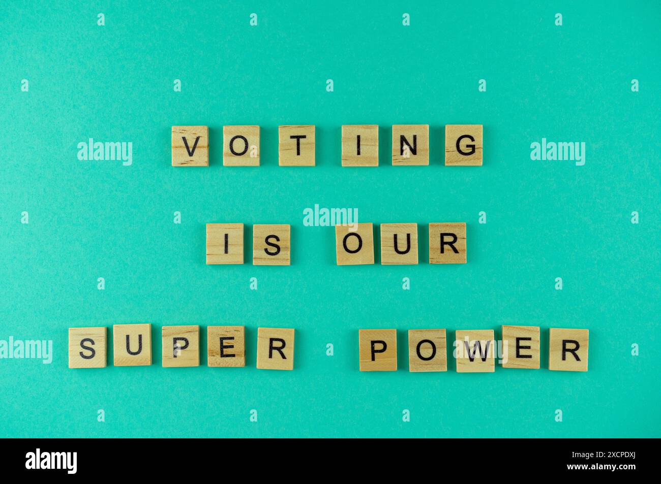 Words voting is our superpower. The phrase is laid out in wooden ...