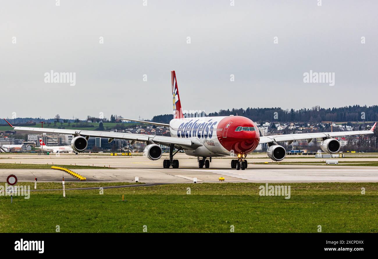 An Airbus A340-313X operated by Edelweiss Air taxies onto the runway at ...
