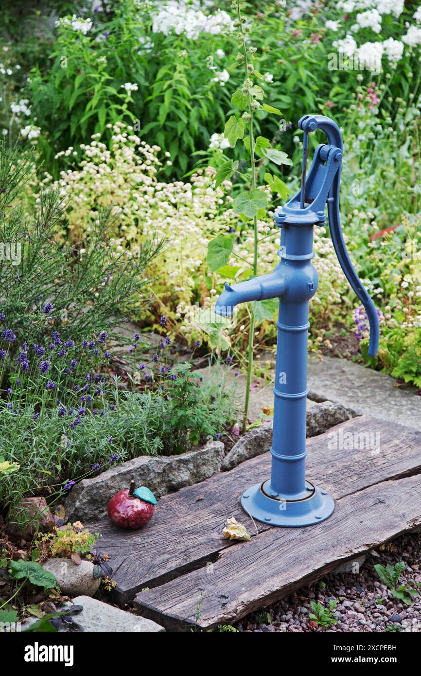 Water pump for a well in a garden Stock Photo - Alamy