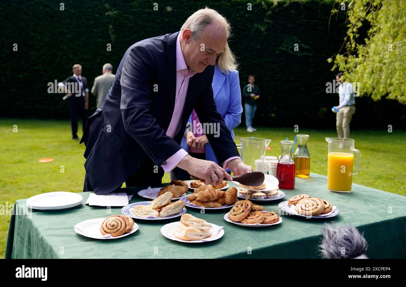 Liberal Democrats leader Sir Ed Davey serves pastries to local ...