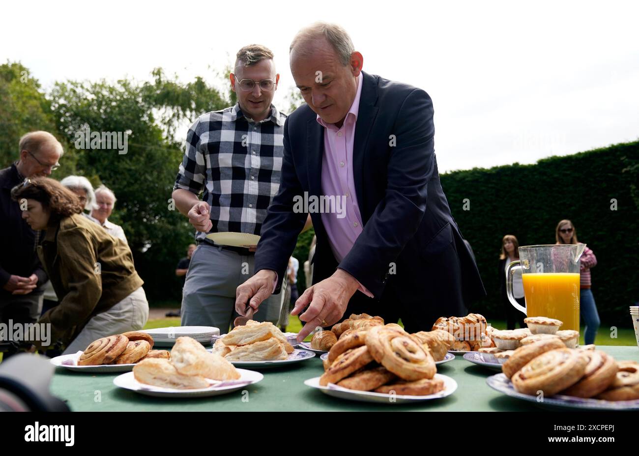 Liberal Democrats leader Sir Ed Davey serves pastries to local ...