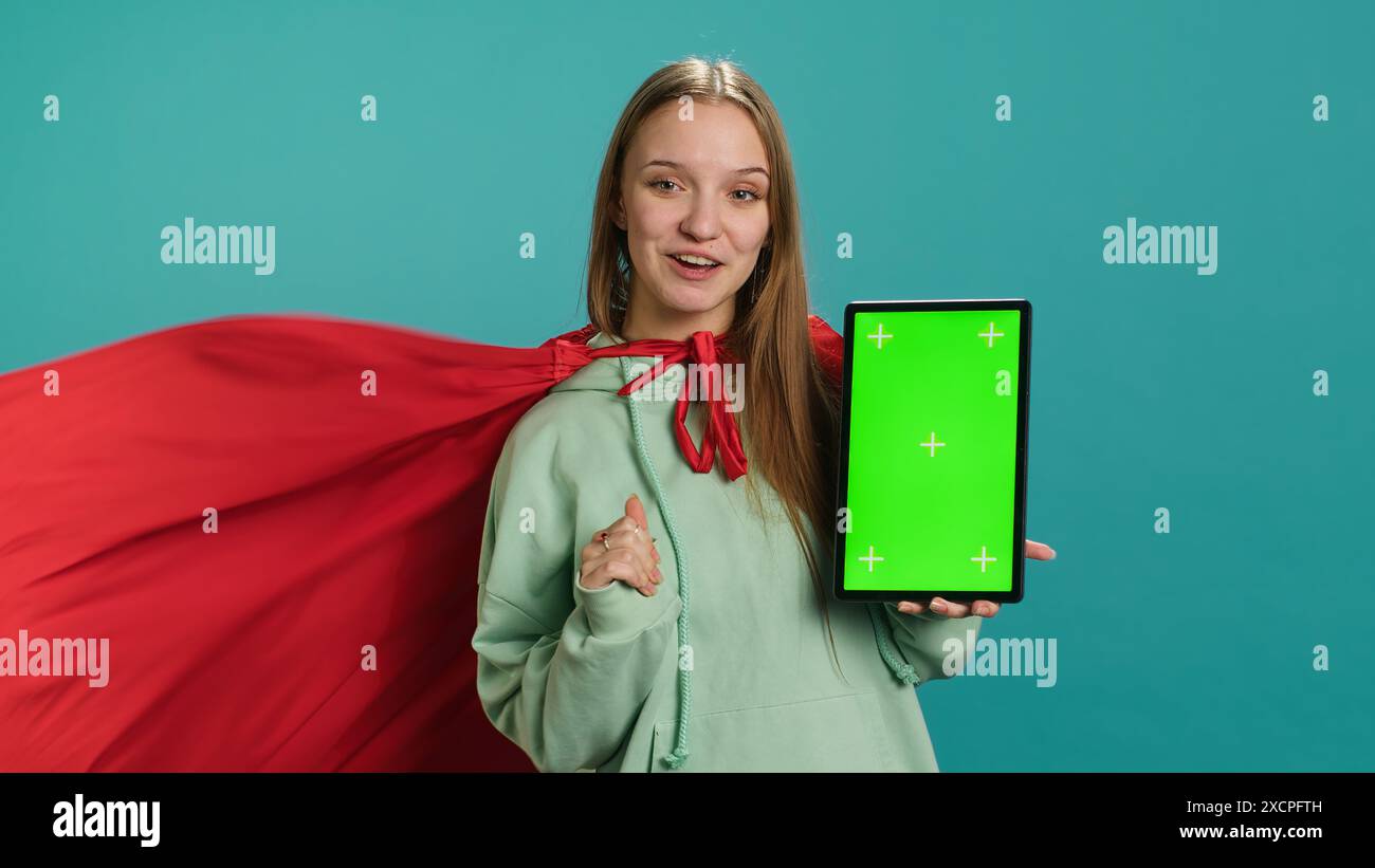 Woman wearing superhero costume presenting and talking about isolated ...