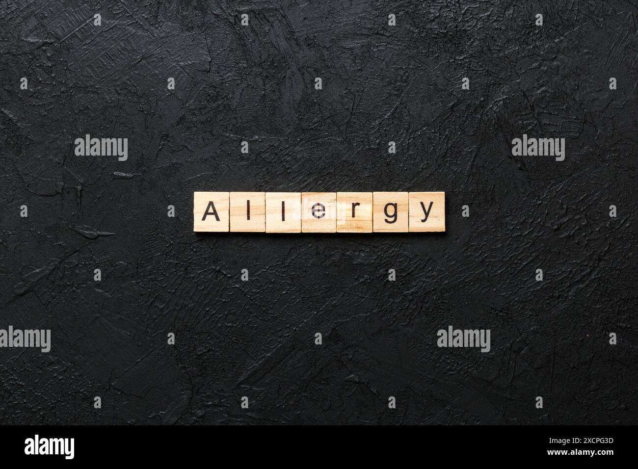 Allergy word written on wood block. Allergy text on cement table for ...