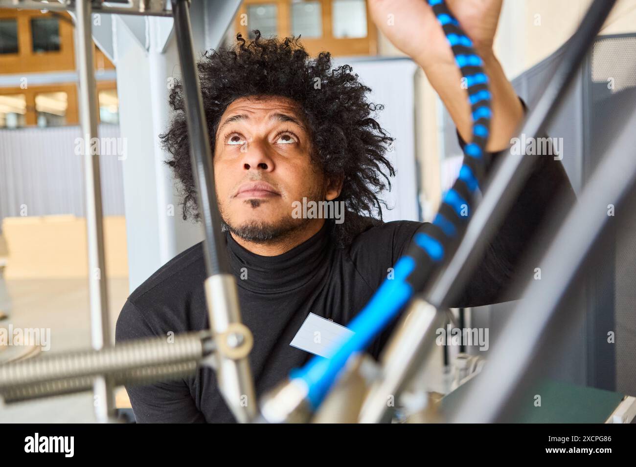 An Engineer Working On A Robotic System With Gripper Arms Used In