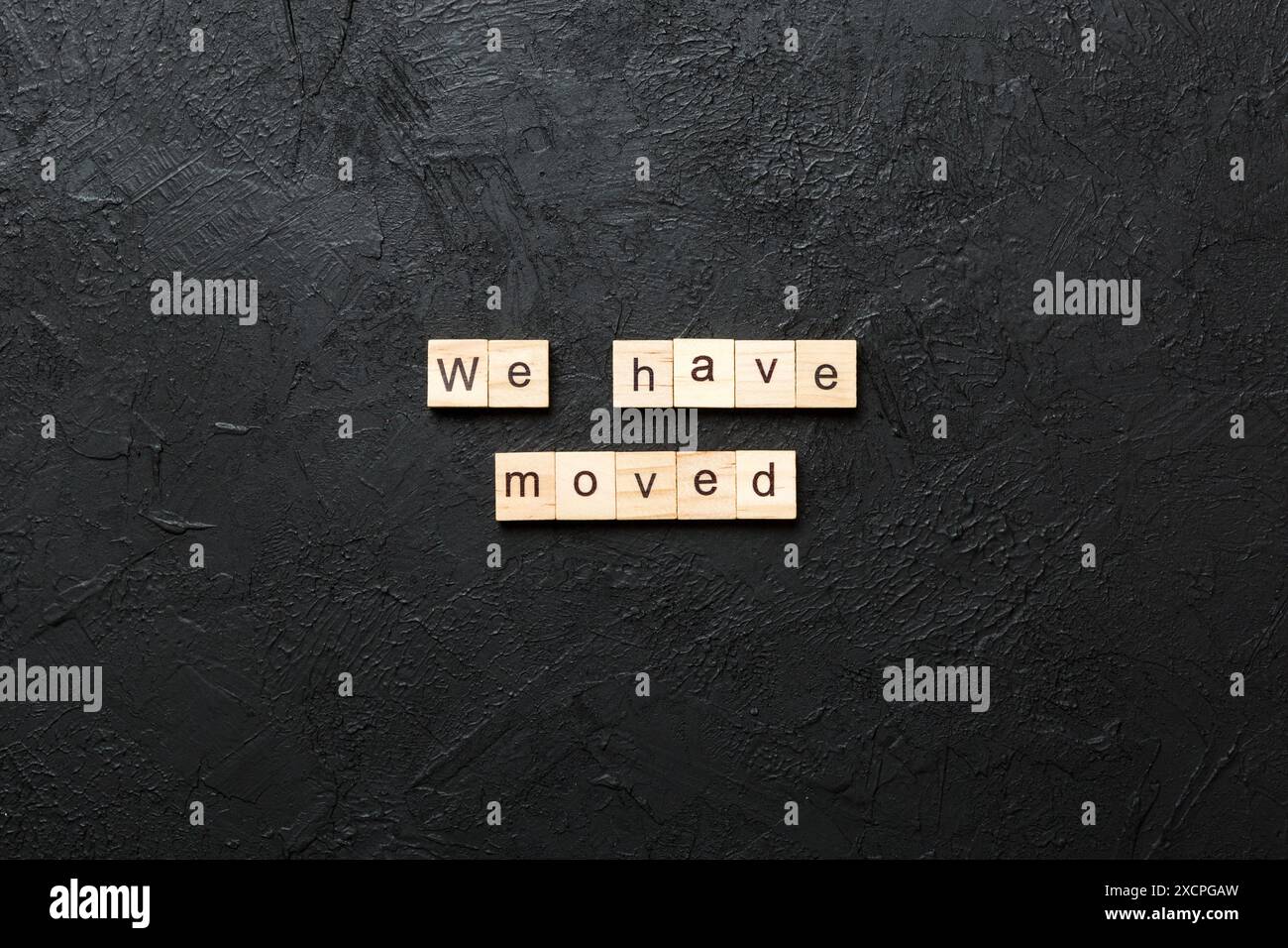 we have moved word written on wood block. we have moved text on cement ...